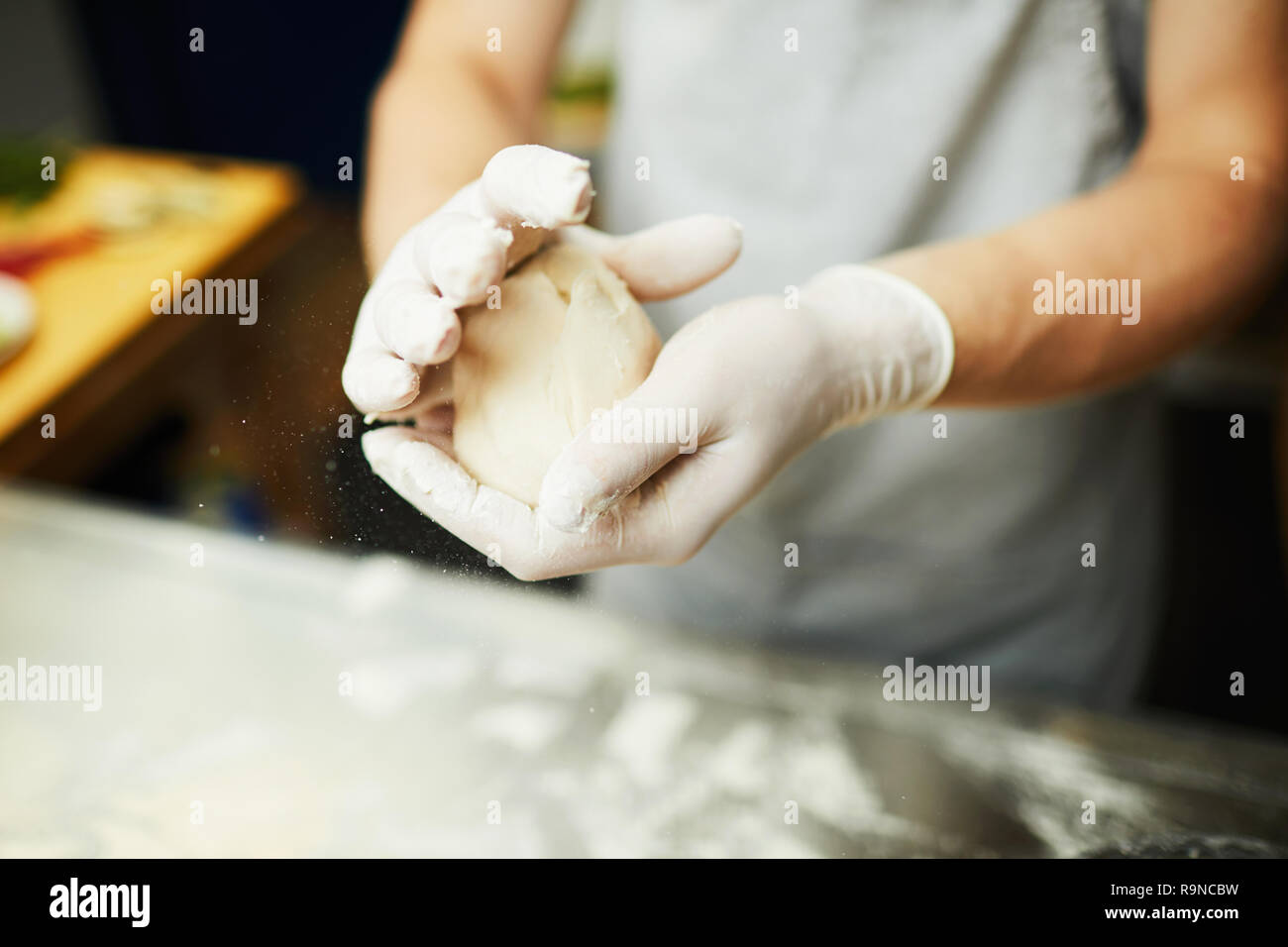 Baker working raw dough hi-res stock photography and images - Alamy