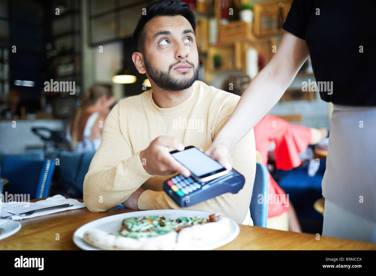 Paying for lunch Stock Photo - Alamy