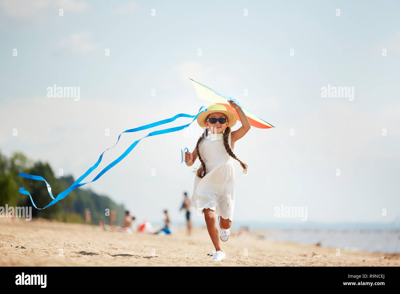 Running with kite Stock Photo - Alamy