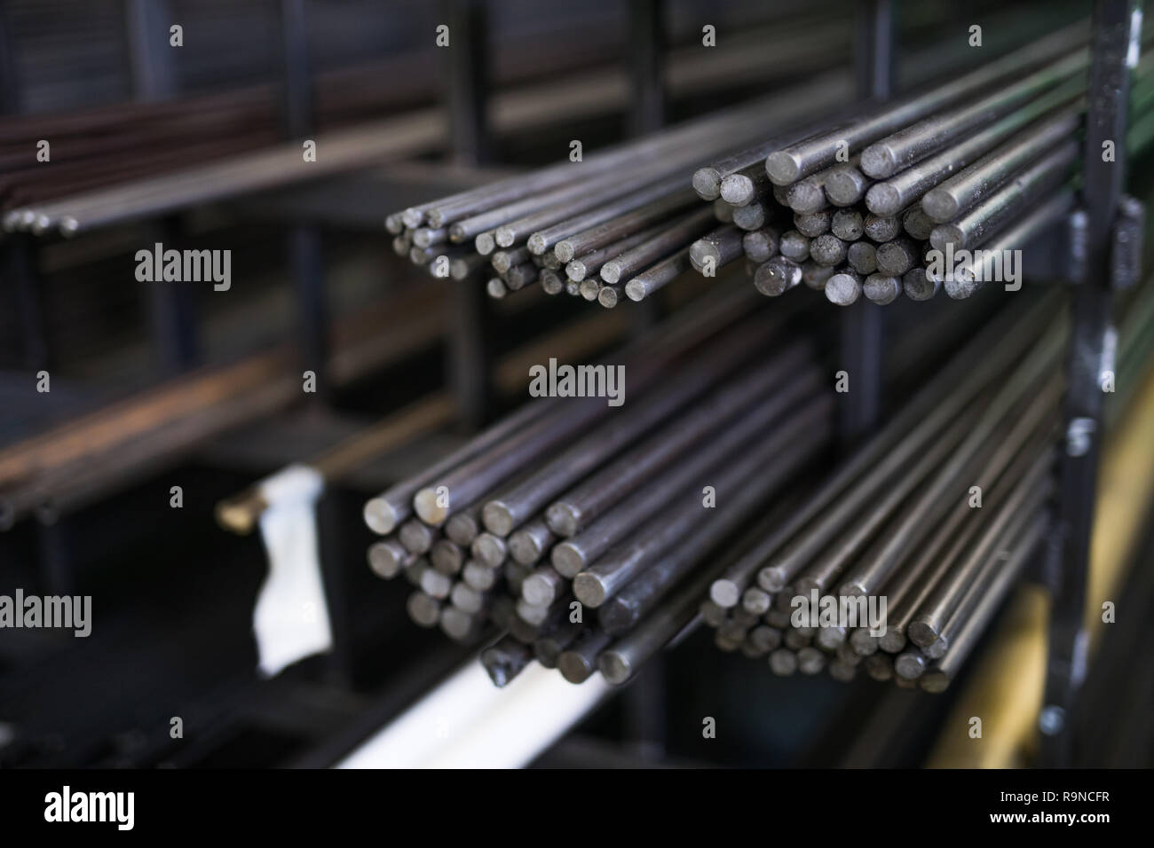 Steel round bar storage Stock Photo - Alamy