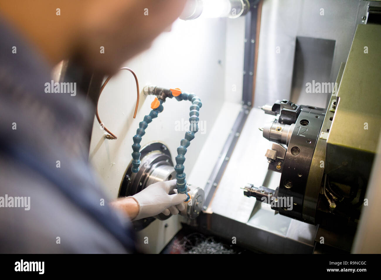 Man working on lathe machine Stock Photo - Alamy