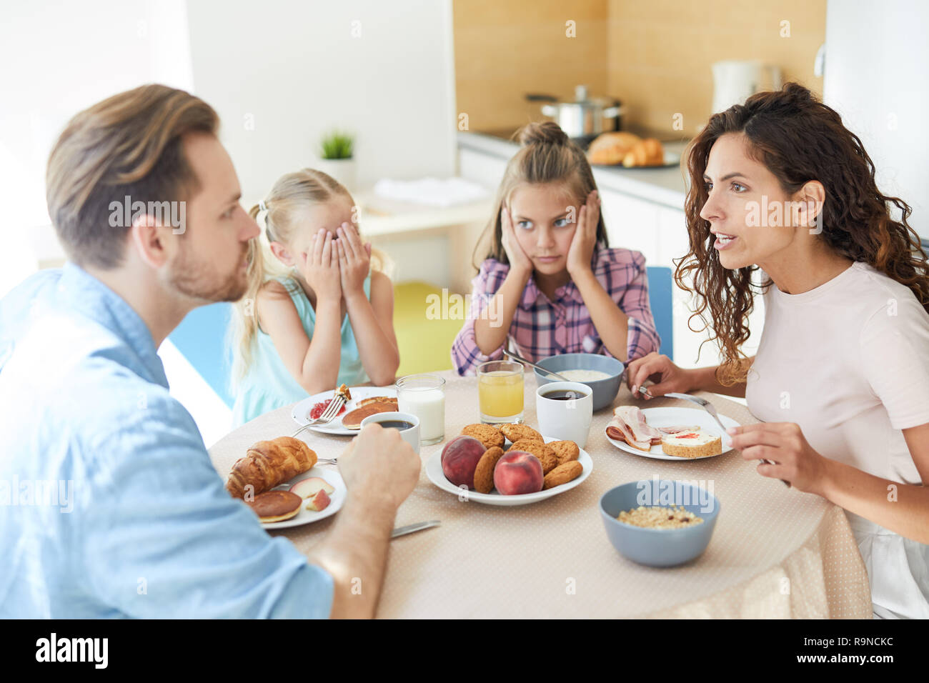 Conflict by table Stock Photo - Alamy