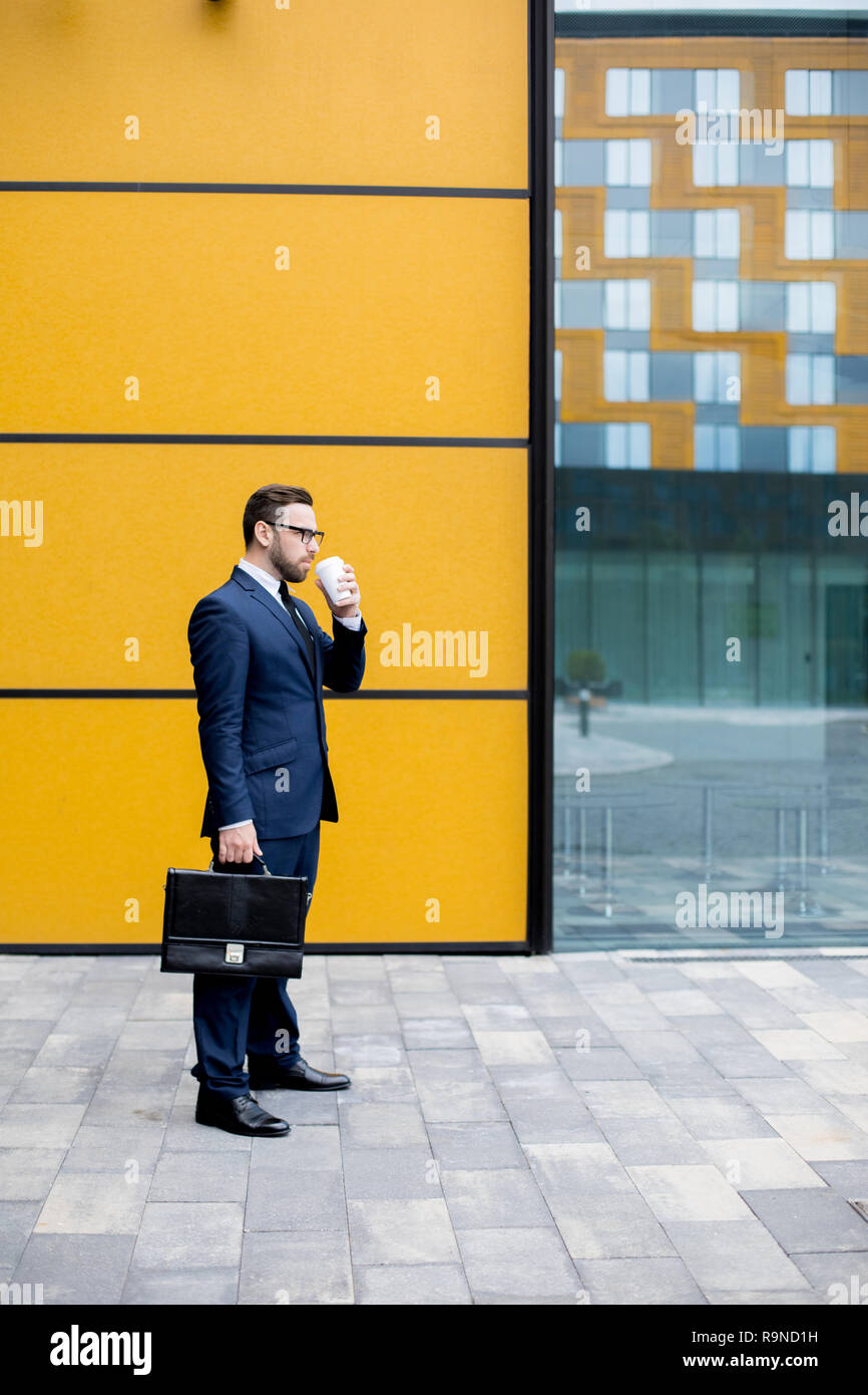 Man standing side view drink hi-res stock photography and images - Alamy