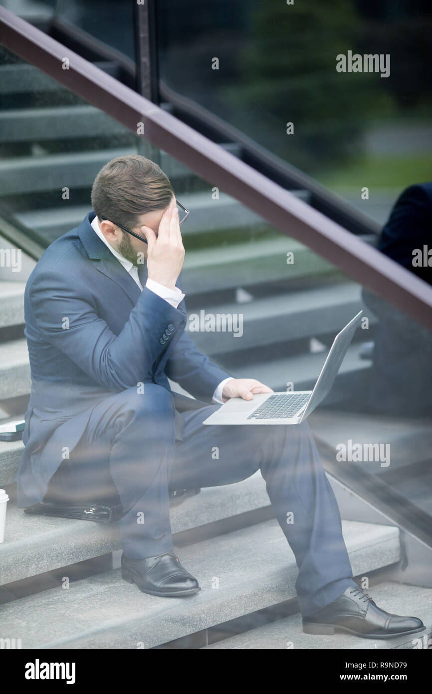 Man sitting step hi-res stock photography and images - Alamy