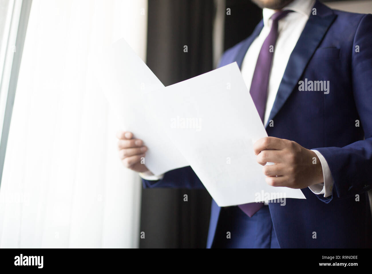 Agent with papers Stock Photo - Alamy