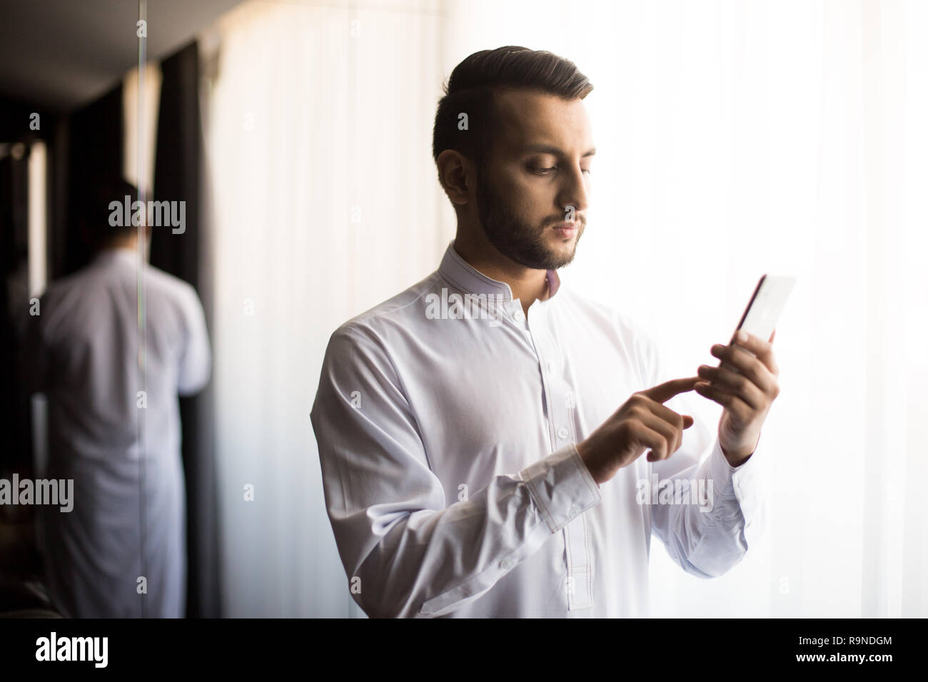 Business man touching smartphone hi-res stock photography and images ...