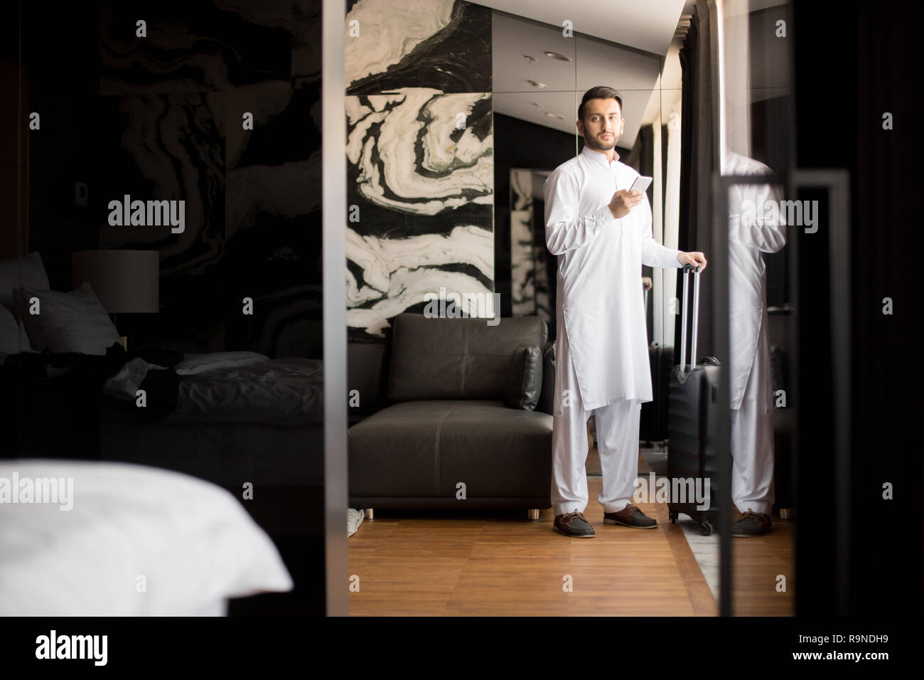 Man in hotel room Stock Photo - Alamy