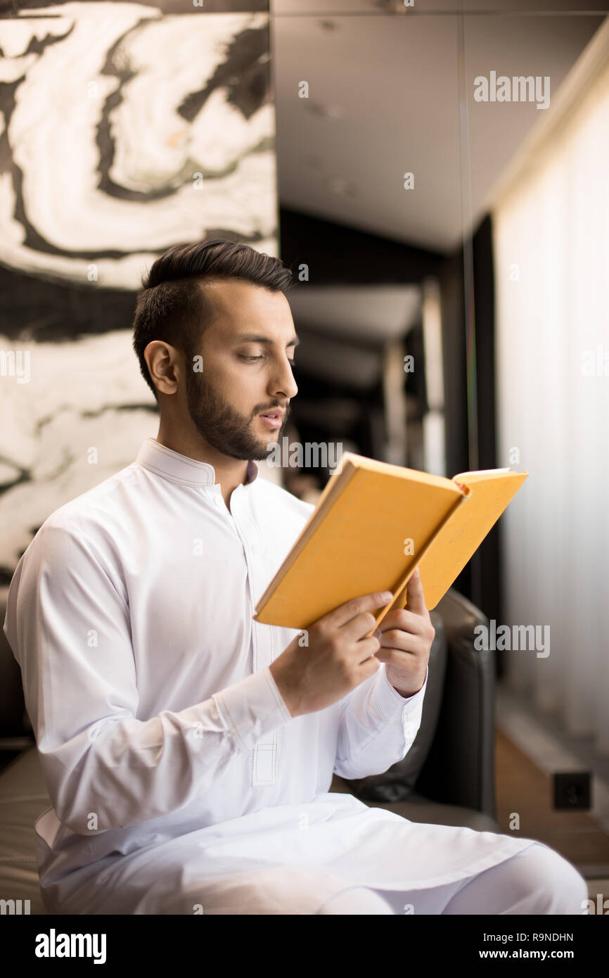 Young man reading Stock Photo - Alamy