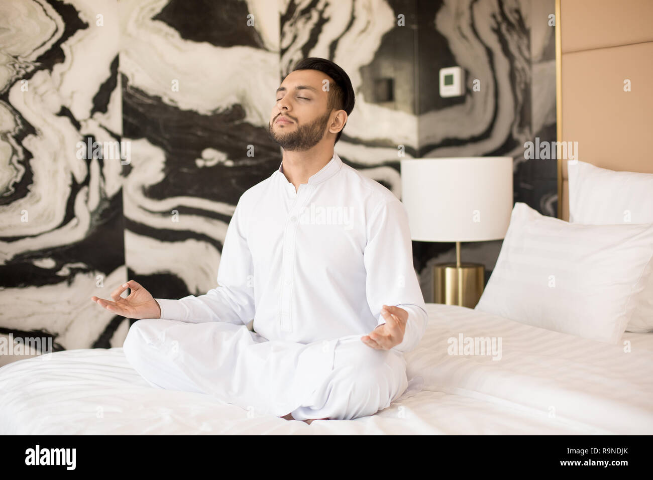 Meditation man bed hi-res stock photography and images - Alamy