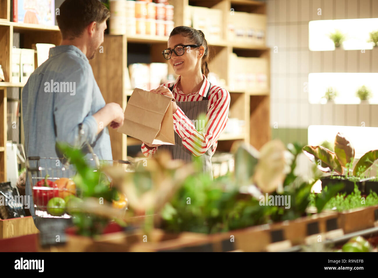 Shop assistant serving customer hi-res stock photography and images - Alamy