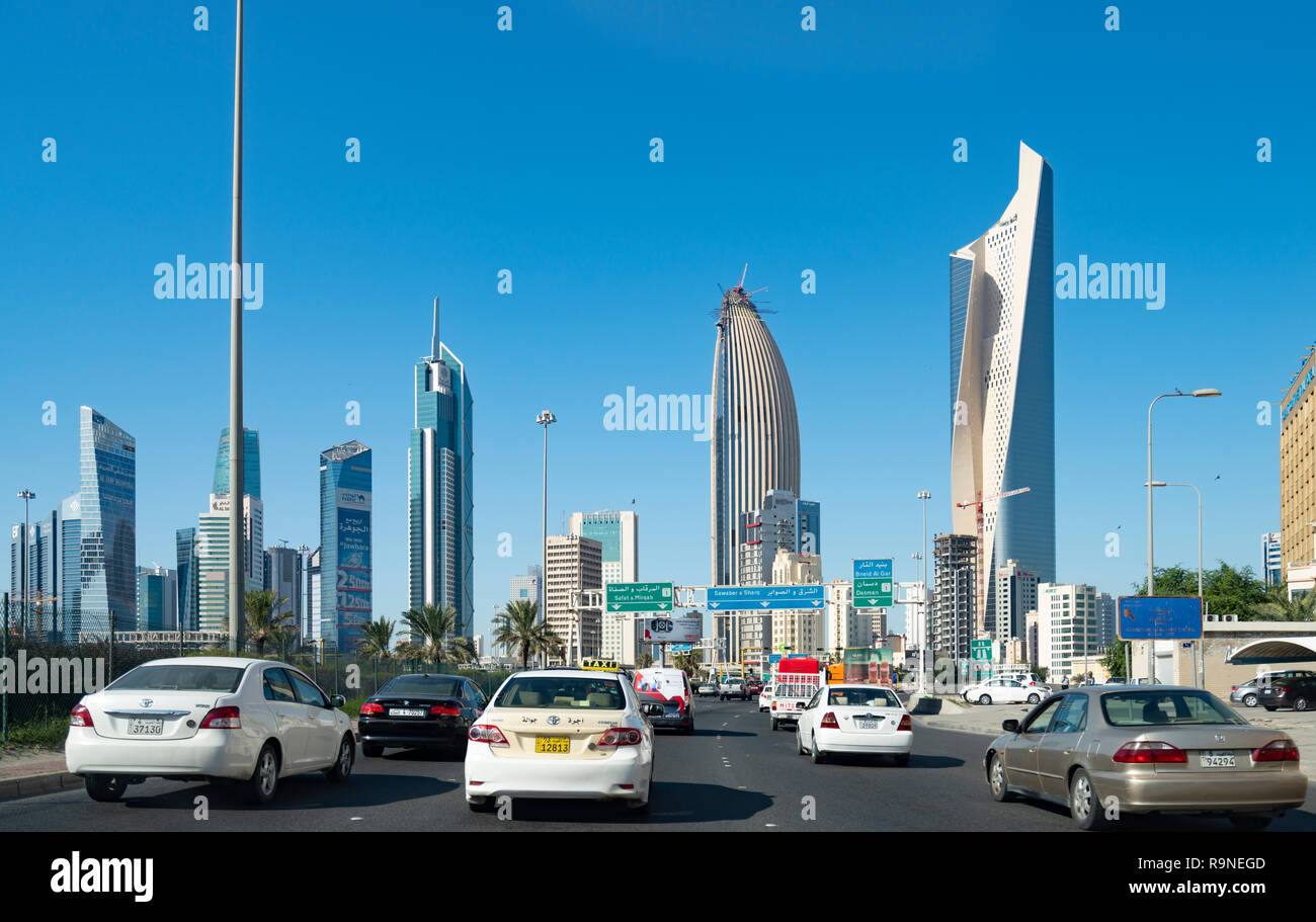 Skyline of downtown Kuwait City and traffic on highway in Kuwait ...