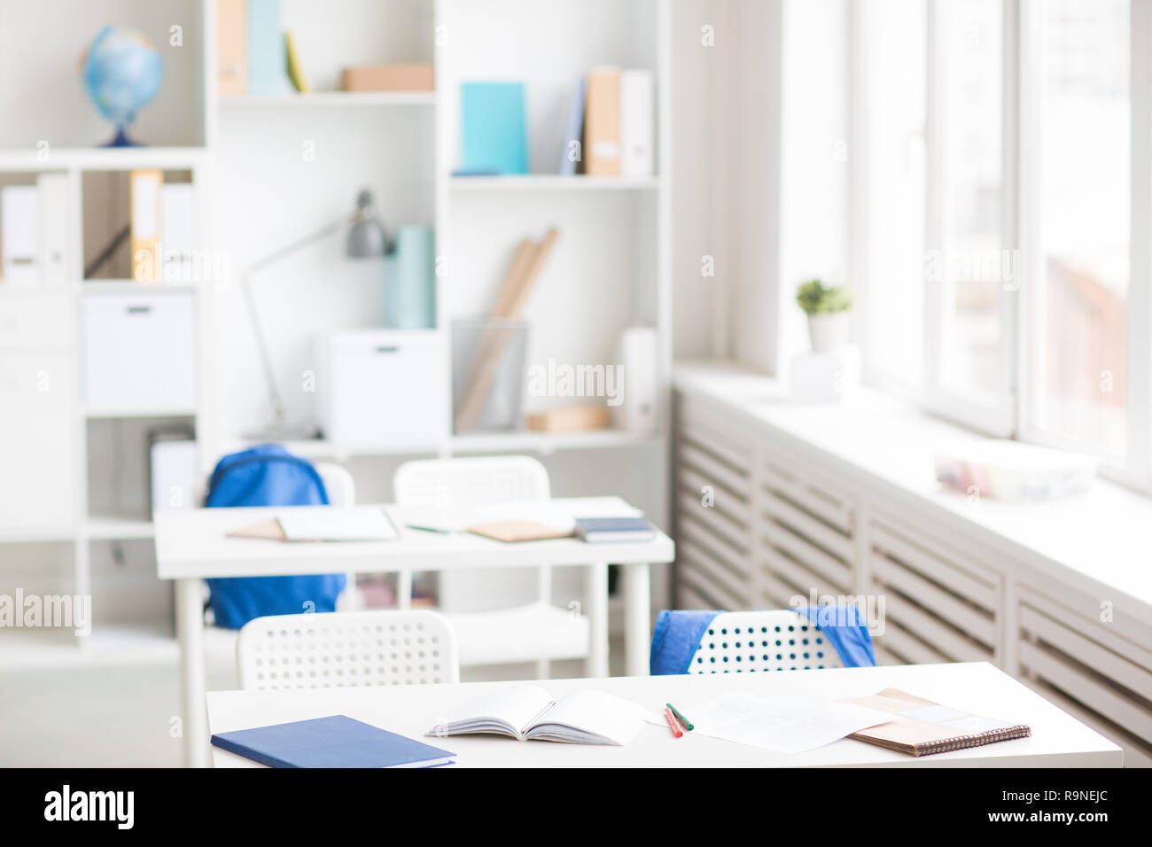 Row of school desks hi-res stock photography and images - Alamy