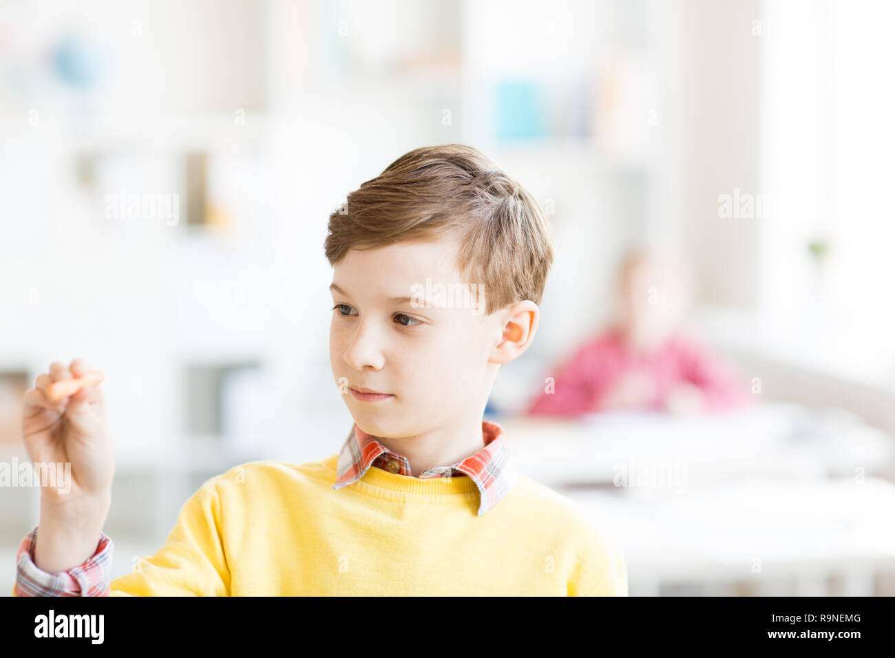 Boy thinking of idea Stock Photo - Alamy