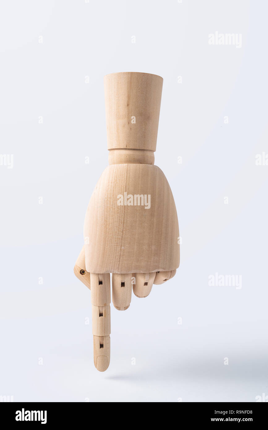 Business and design concept - wooden hand with down posture isolated on ...