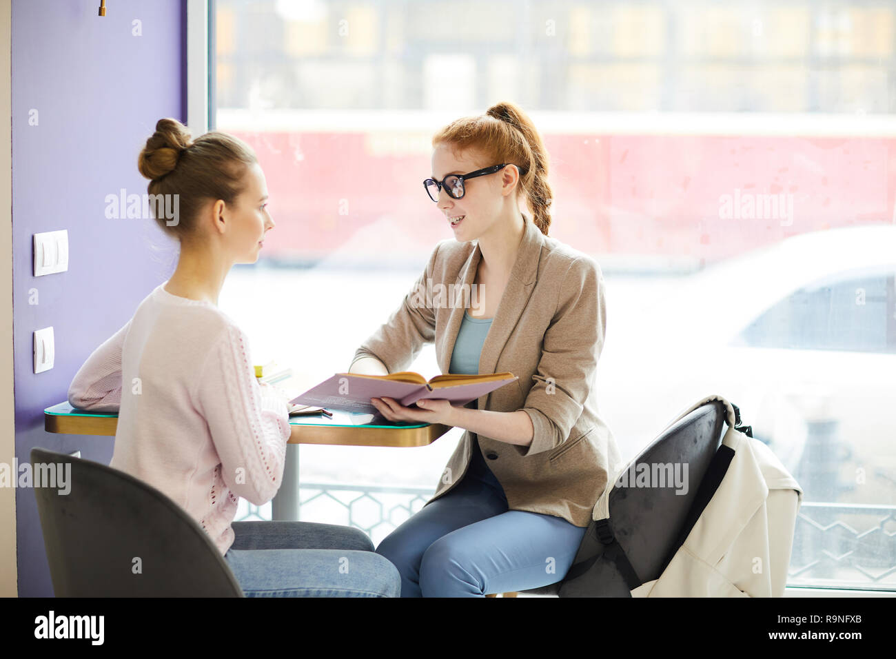 Discussing home assignment Stock Photo - Alamy
