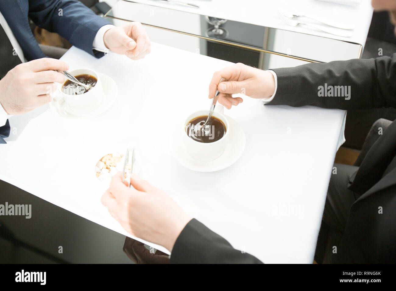 Drinking coffee in restaurant Stock Photo - Alamy