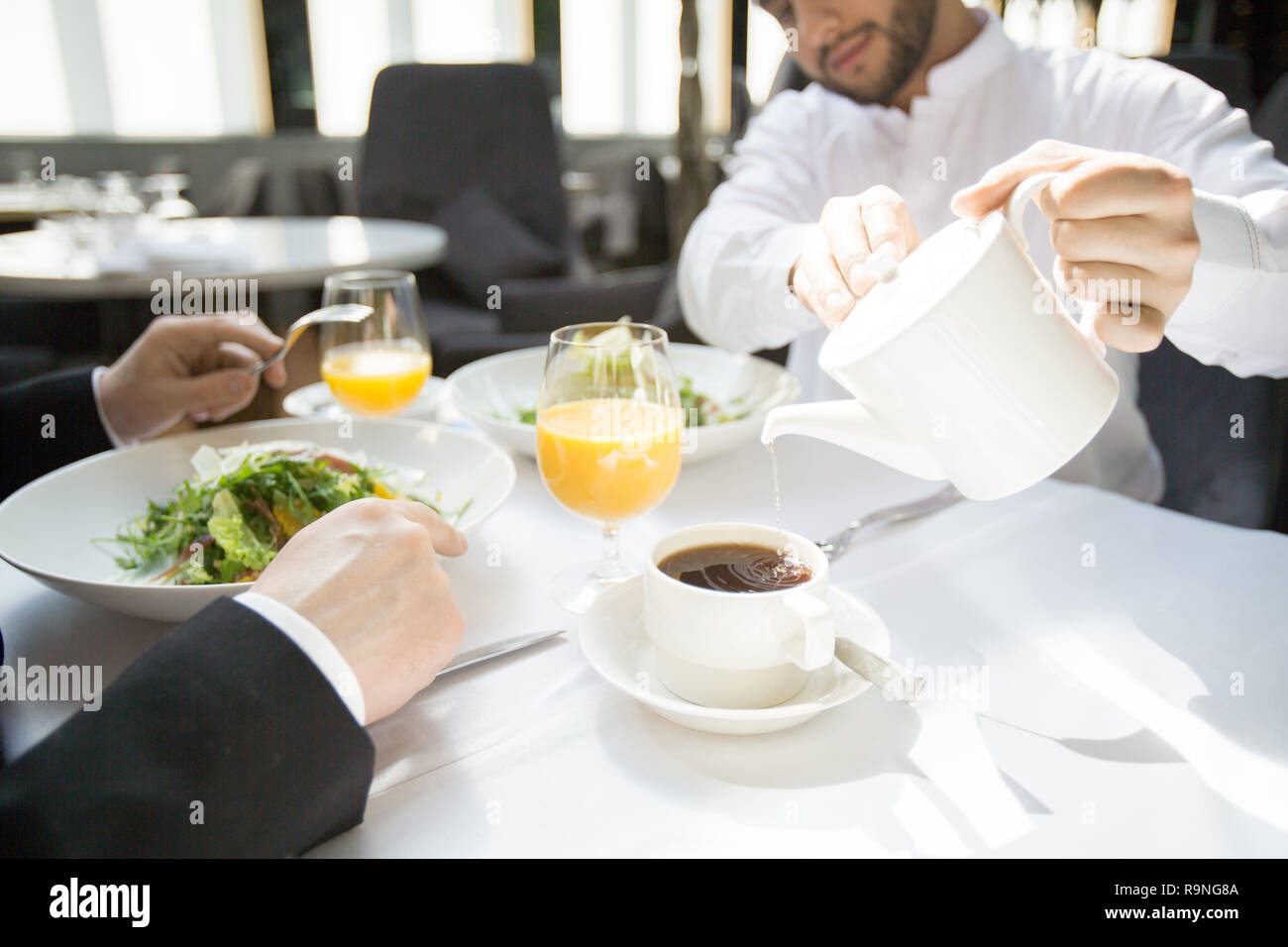 Having business lunch Stock Photo - Alamy