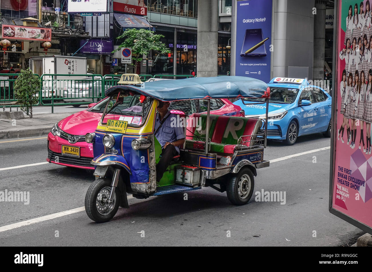 Bangkok, Thailand - Sep 16, 2018. Tuk tuk taxi on street in Bangkok, Thailand. Tuk-tuks or sam ...