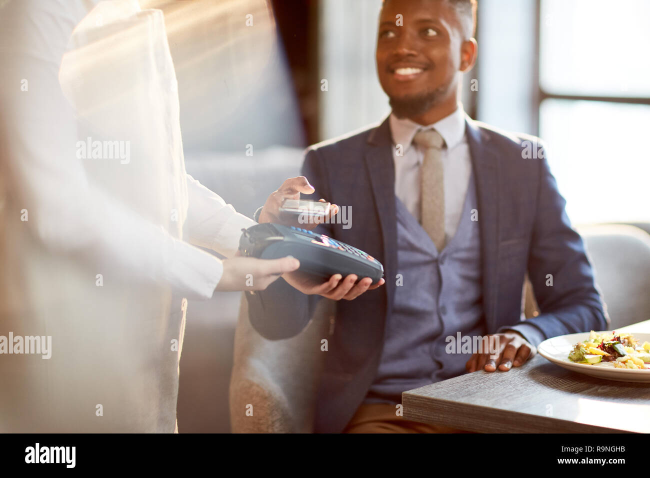 Paying smartphone through contactless nfc hi-res stock photography and ...