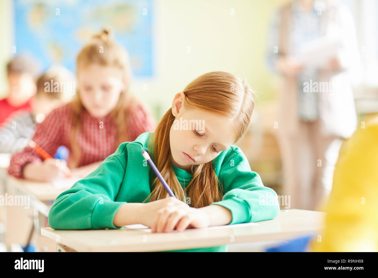 Writing test at lesson Stock Photo - Alamy
