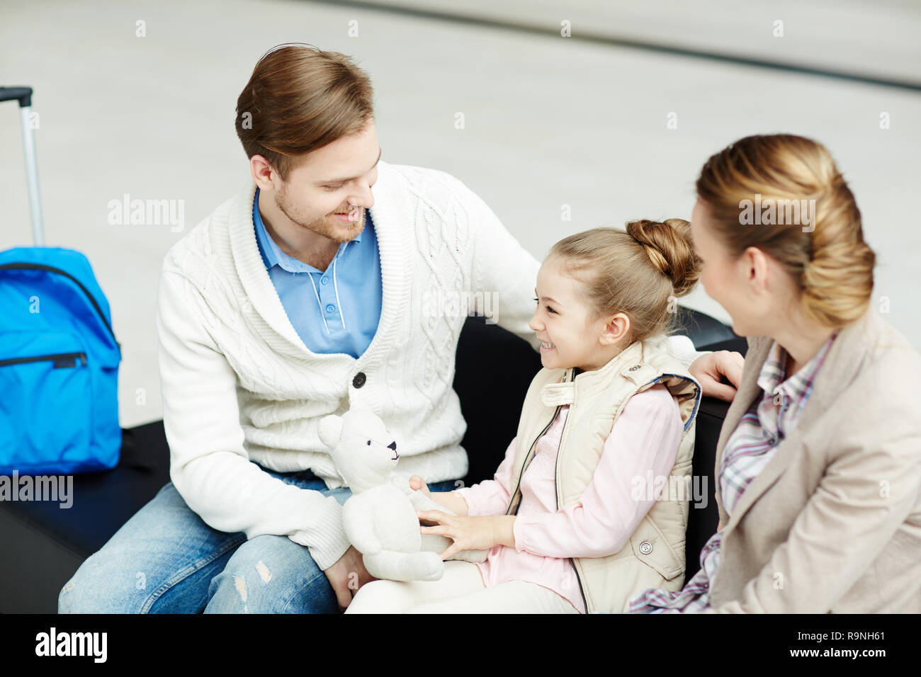 Family in lounge Stock Photo - Alamy