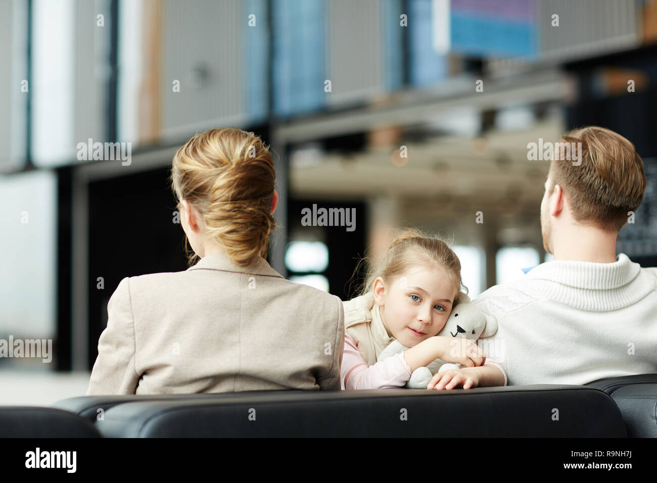 Girl with parents Stock Photo - Alamy