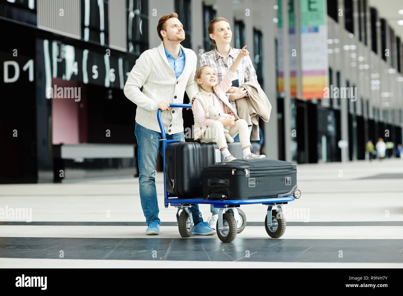 Travelers in airport Stock Photo - Alamy