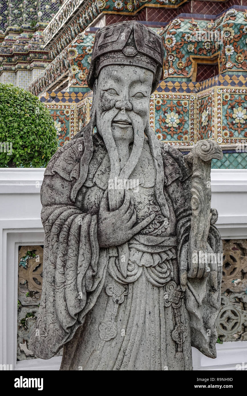 Chinese guardian figure beside a gate in Wat Pho. Wat Pho is one of the ...