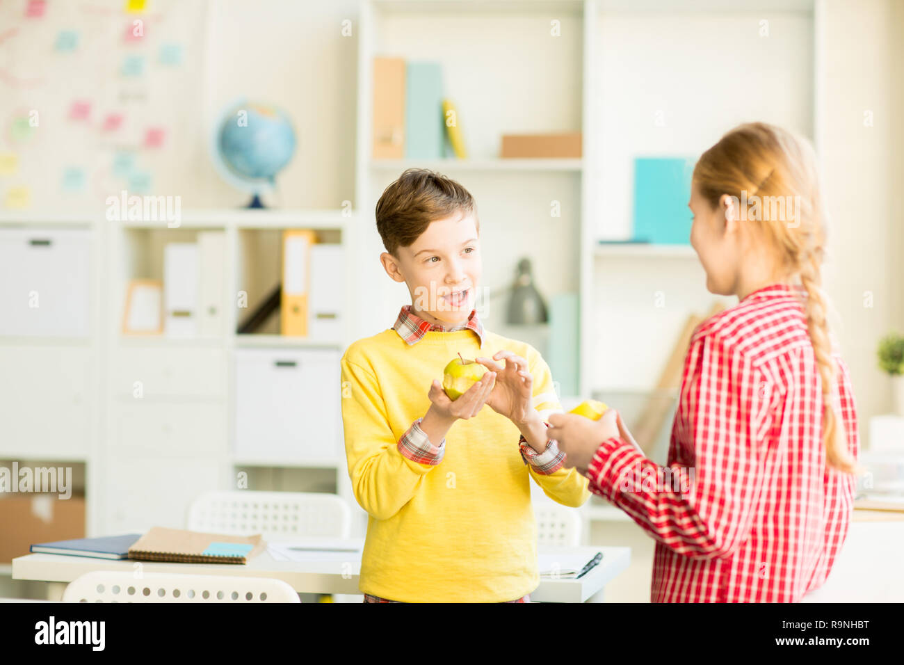 Conversation of classmates Stock Photo - Alamy