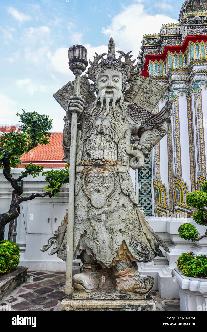 Chinese guardian figure beside a gate in Wat Pho. Wat Pho is one of the ...