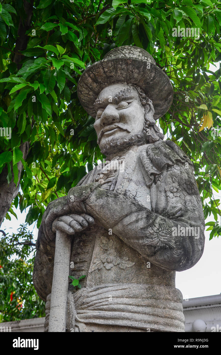 Chinese guardian figure beside a gate in Wat Pho. Wat Pho is one of the ...