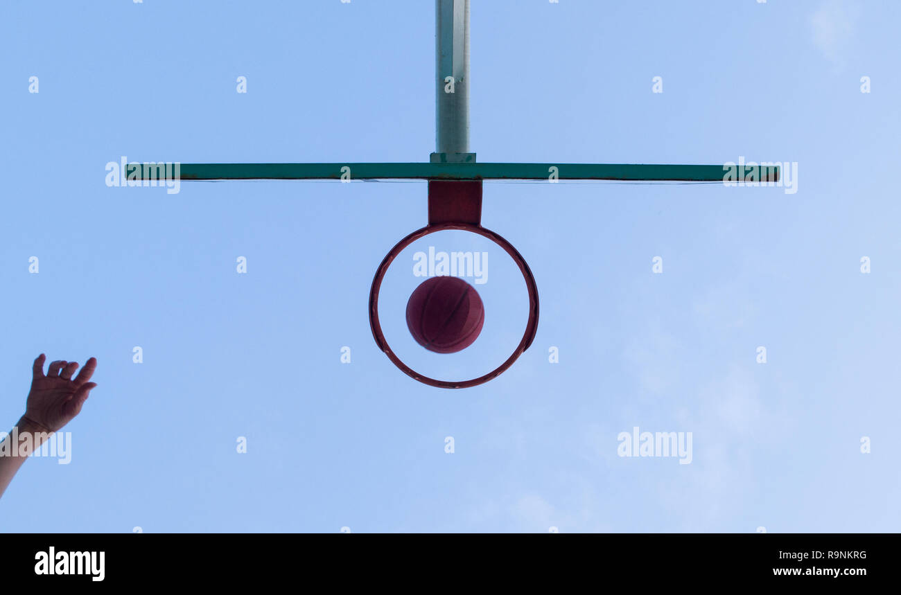 Ball falling through a basketball Hoop Stock Photo - Alamy