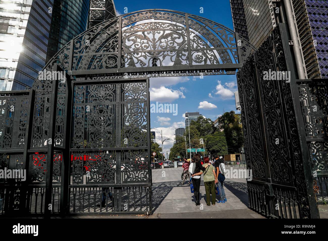 Chapultepec forest grilles and Reform buildings. Urban park in the city ...