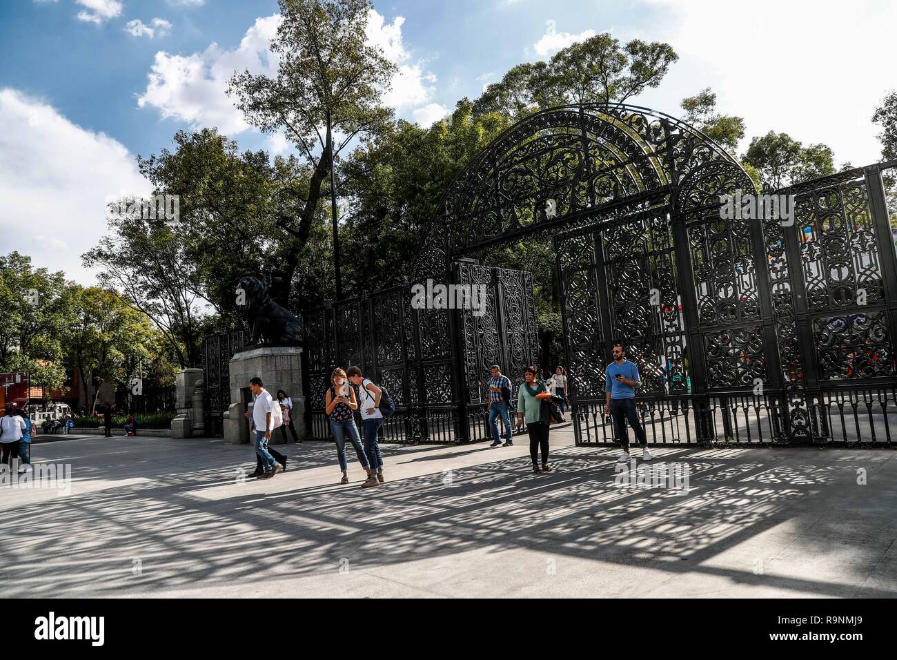 Chapultepec forest grilles and Reform buildings. Urban park in the city ...