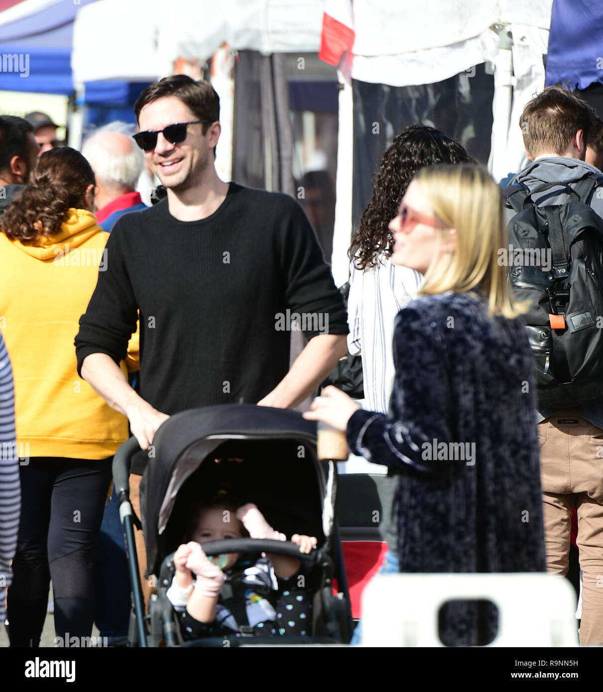 Topher Grace goes to the Farmers Market with his wife and their baby ...