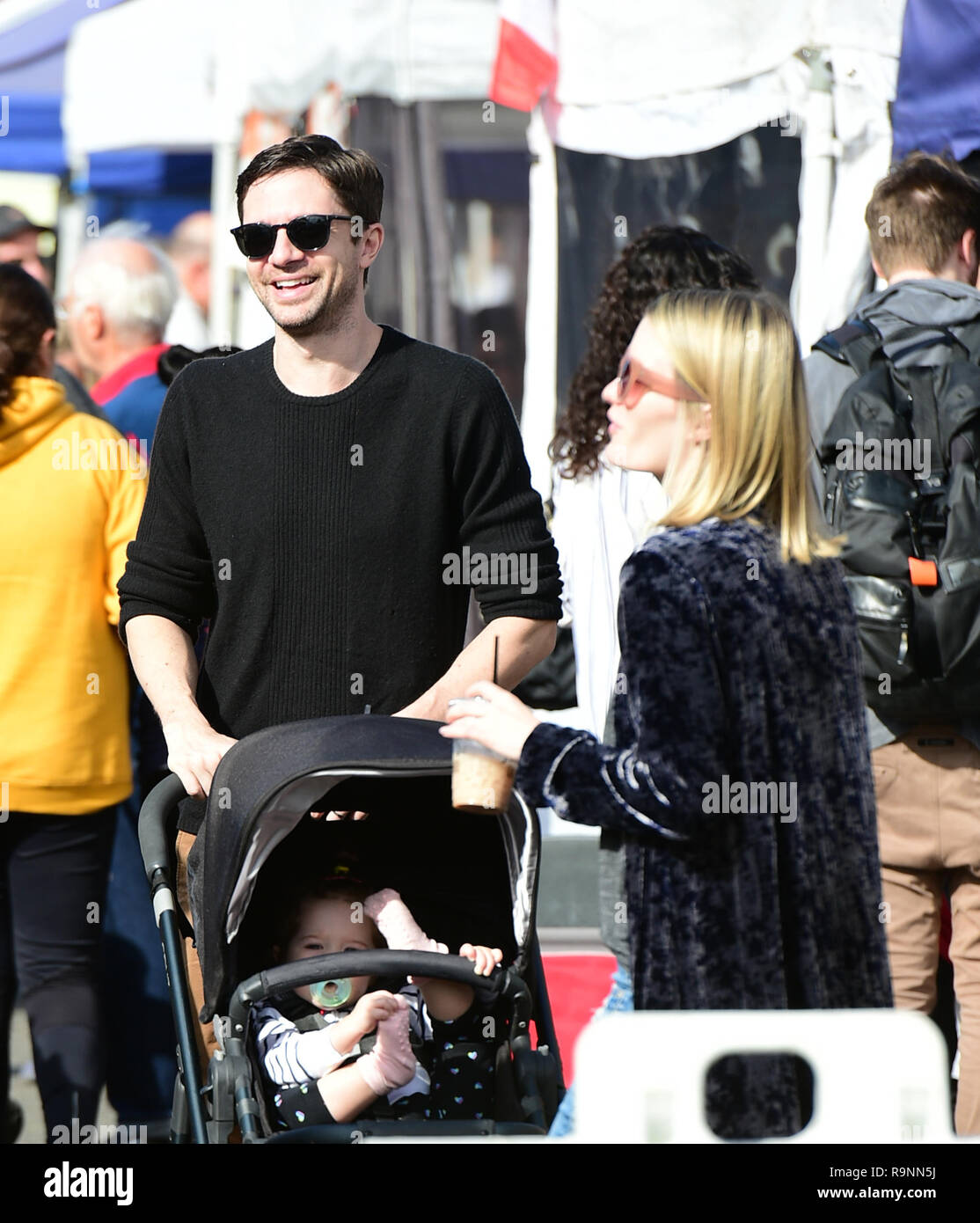 Topher Grace goes to the Farmers Market with his wife and their baby ...