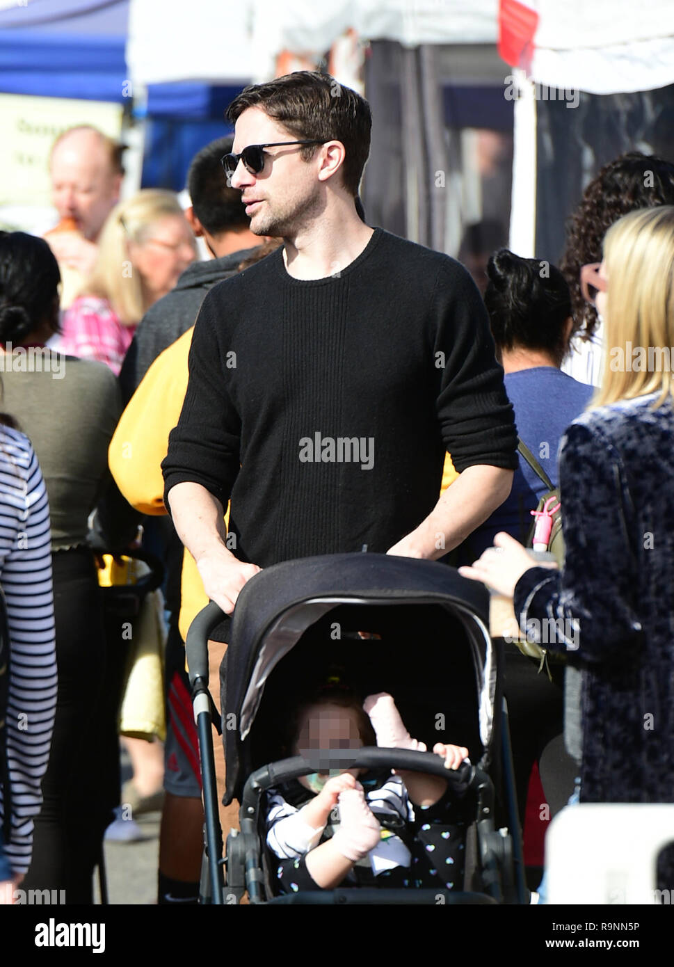 Topher Grace goes to the Farmers Market with his wife and their baby ...