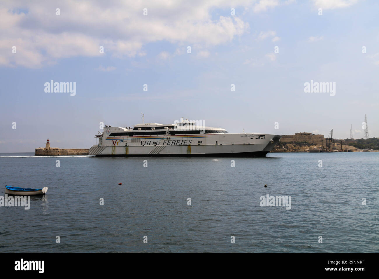 A big ferry ship entering to Valletta's harbour at Valletta, Malta ...