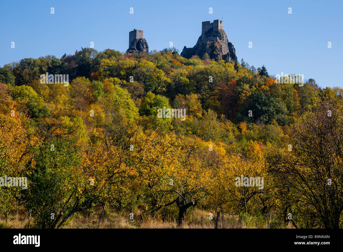 Autumn landscape in Bohemia dominating the ruins of a medieval castle ...