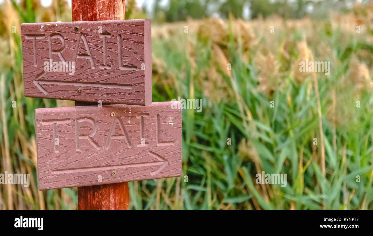 Directional trail sign against grasses in Provo Stock Photo - Alamy