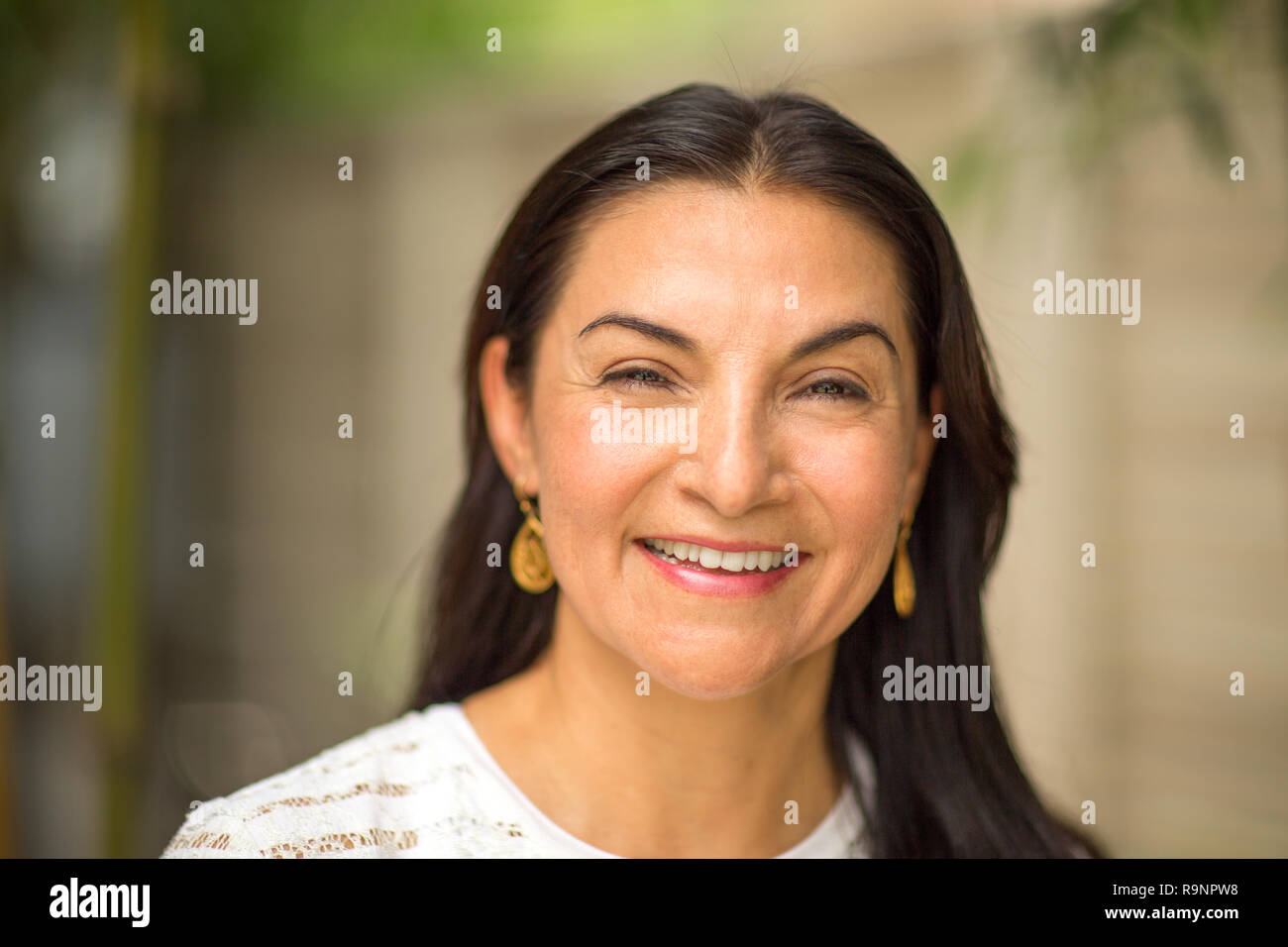 Mature hispanic woman in white hi-res stock photography and images - Alamy