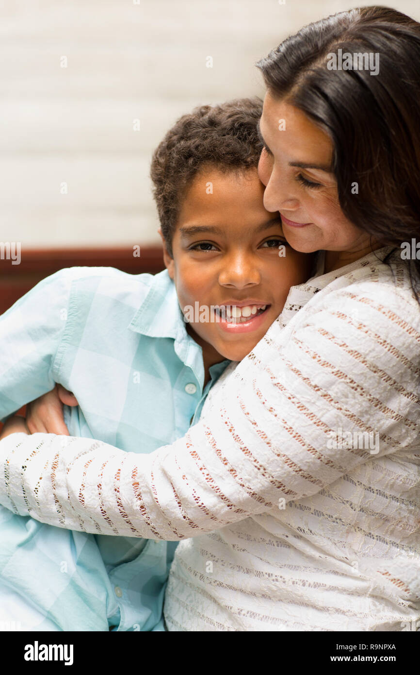 Portrait of a loving mom hugging her son Stock Photo - Alamy Portrait of a loving mom hugging her son Stock Photo - Alamy