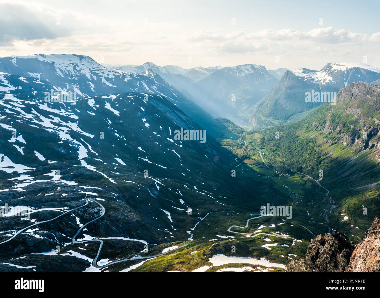 Serpentine road winding down in valley at mountains in Norway Stock ...