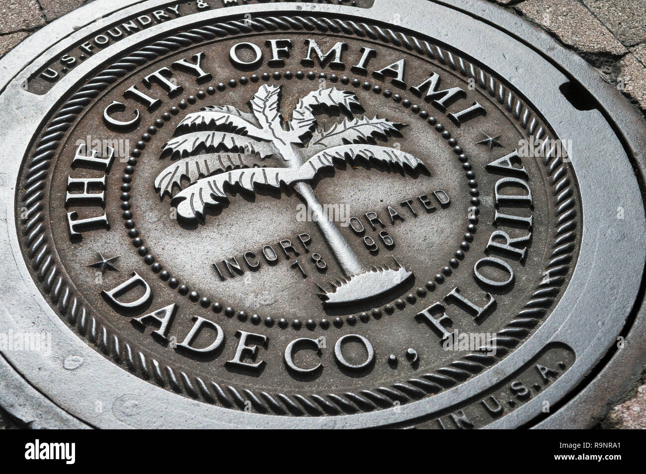 MIAMI - SEPTEMBER, 2018: A stylized palm tree decorates a manhole cover ...