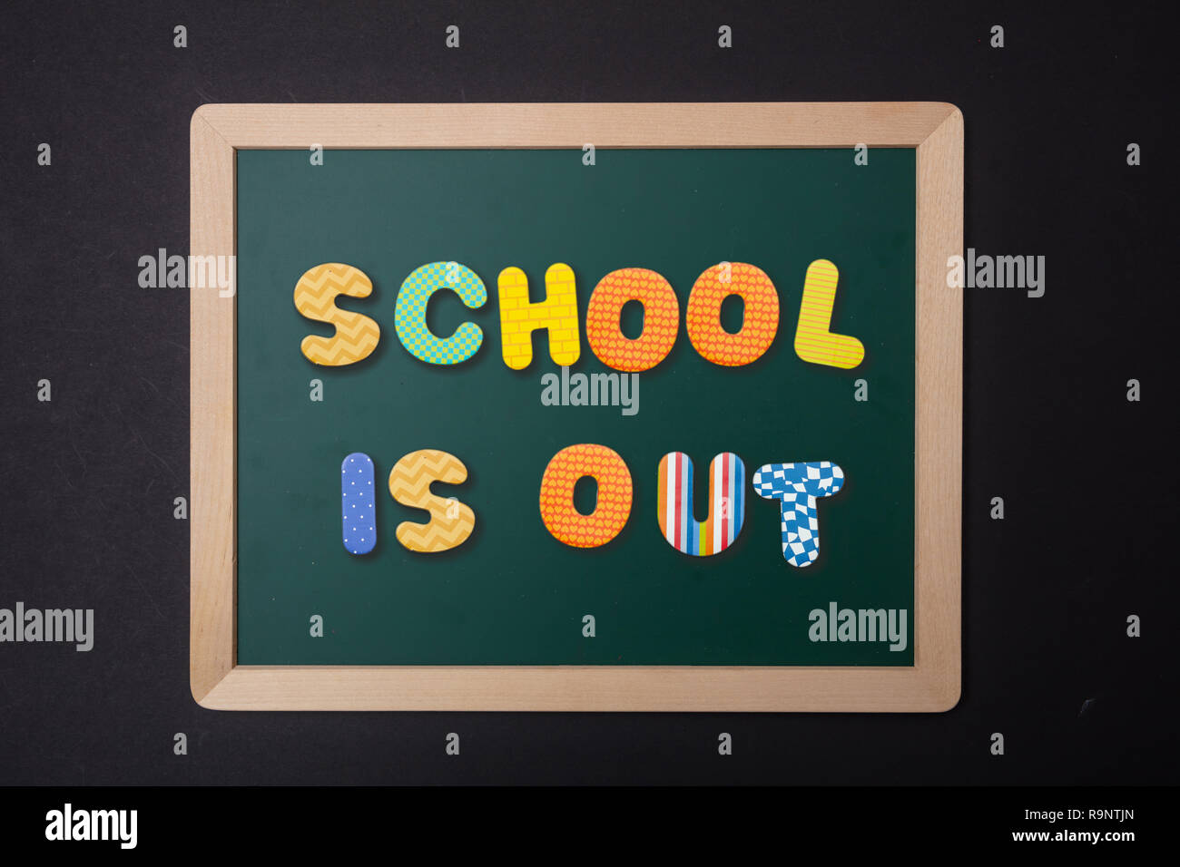 School is out concept. Green chalkboard with wooden frame, text school ...