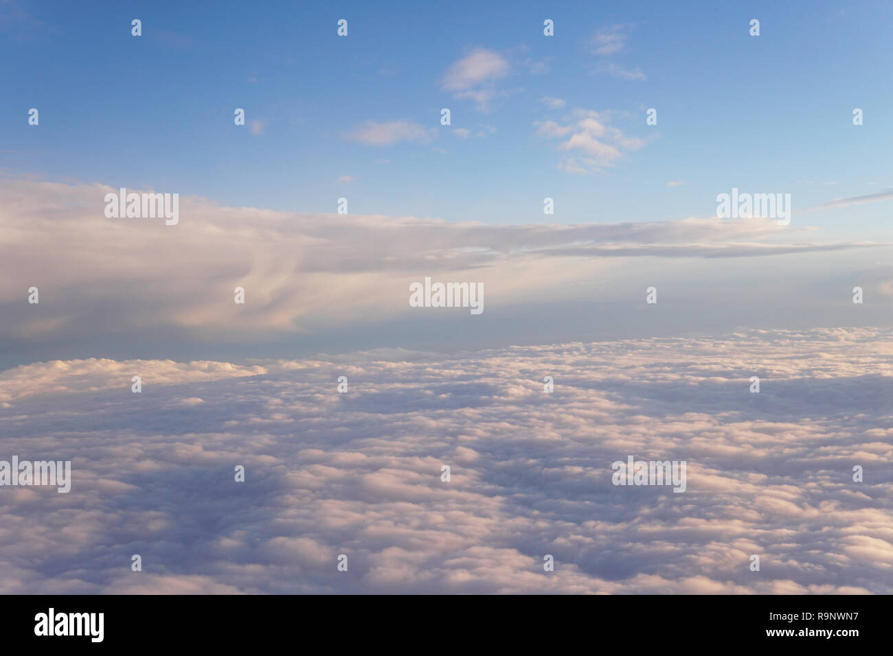 Sky with clouds at sunset from inside the plane landscape Stock Photo ...