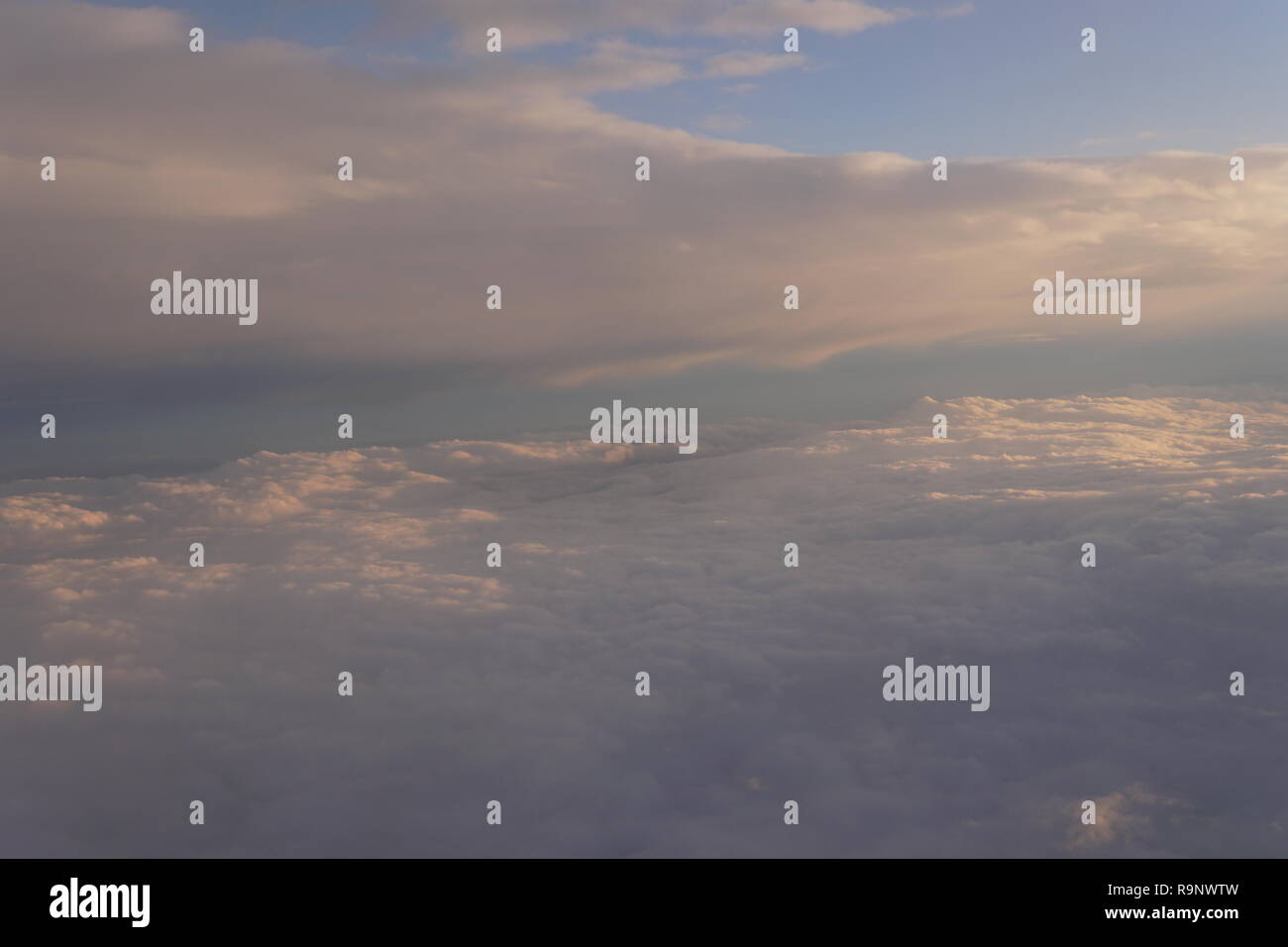 Sky with clouds at sunset from inside the plane landscape Stock Photo ...