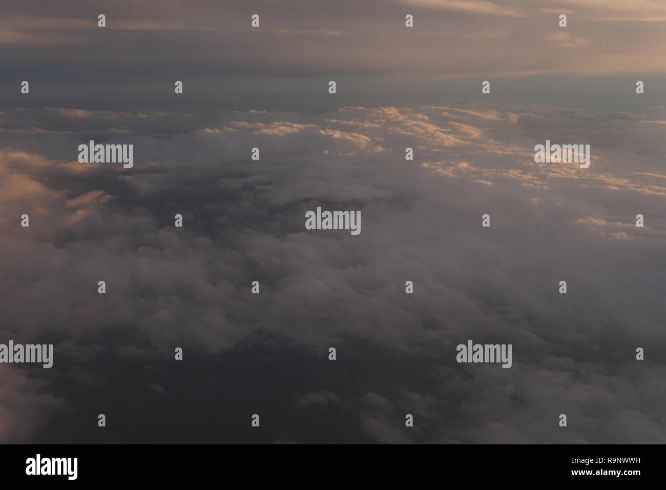 Sky with clouds at sunset from inside the plane landscape Stock Photo ...