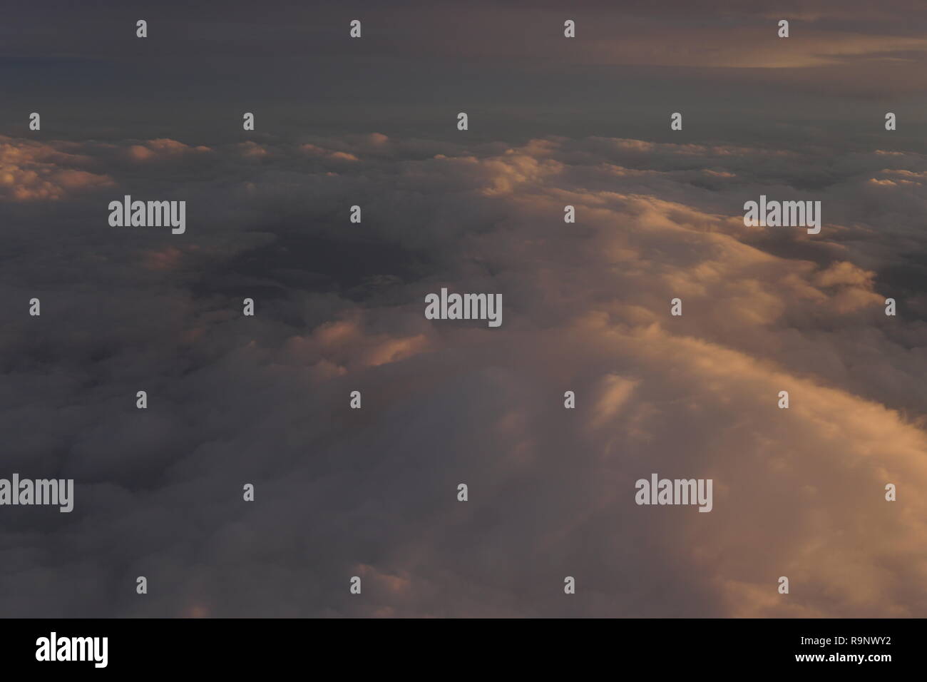 Sky with clouds at sunset from inside the plane landscape Stock Photo ...