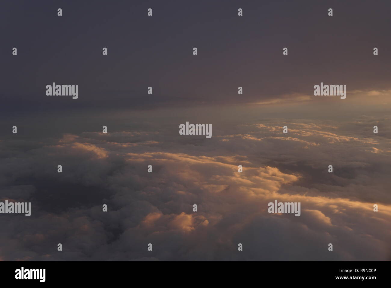 Sky with clouds at sunset from inside the plane landscape Stock Photo ...